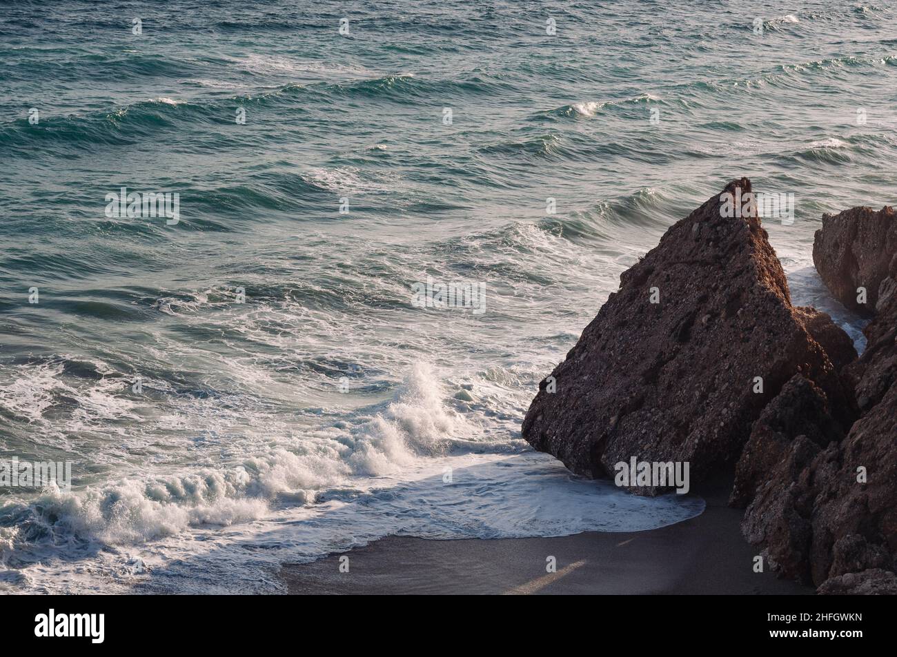 Sunset. Wild rock beach. The natural rock formation Stock Photo - Alamy