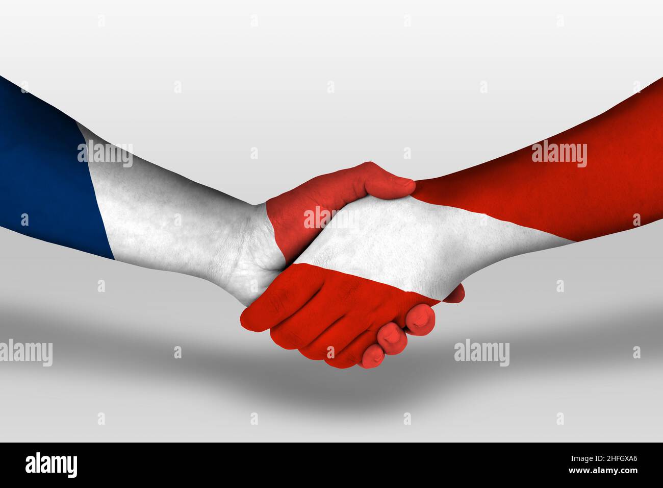 Handshake between argentina and france flags painted on hands ...