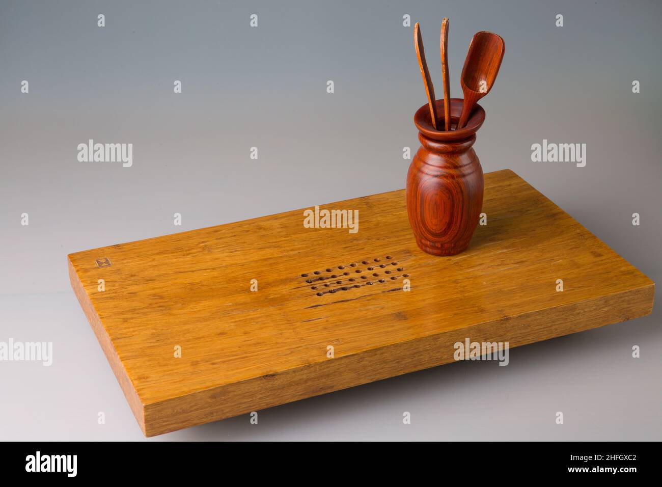 Wooden table for tea ceremonies and a set for brewing tea. In a wooden ...