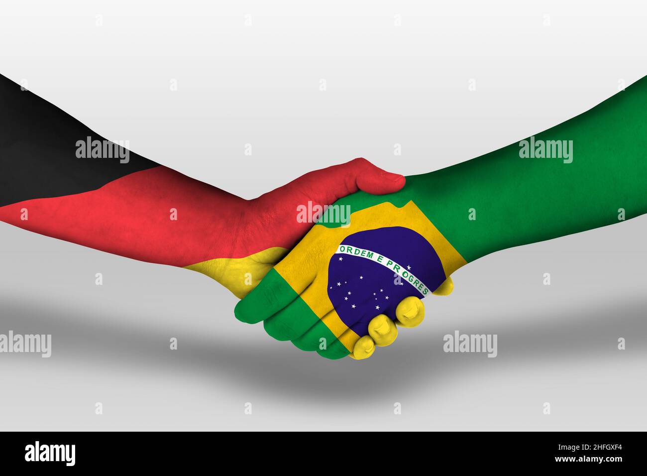Handshake between austria and germany flags painted on hands ...