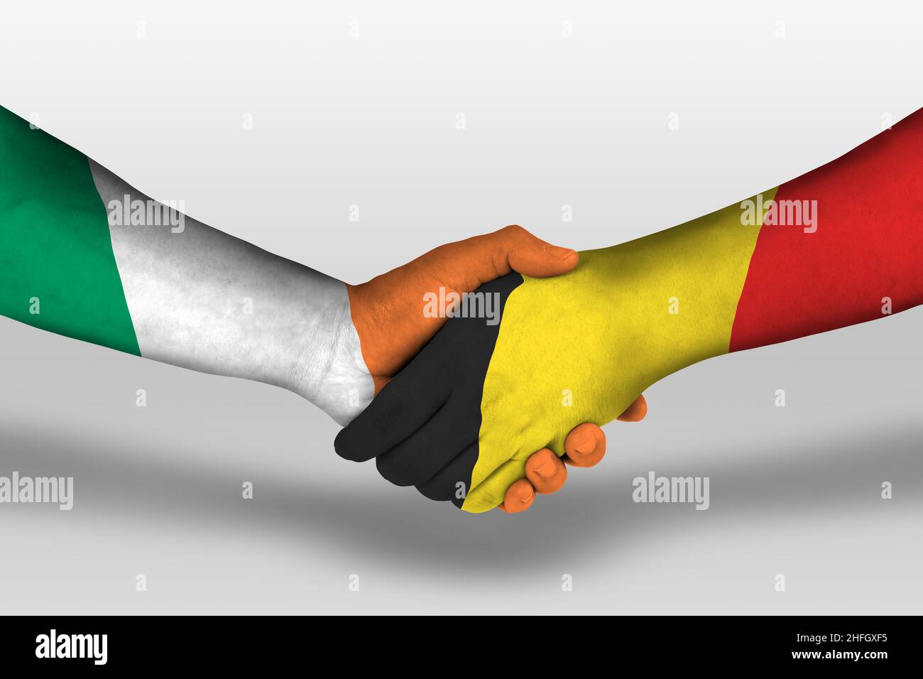 Handshake between austria and ireland flags painted on hands ...