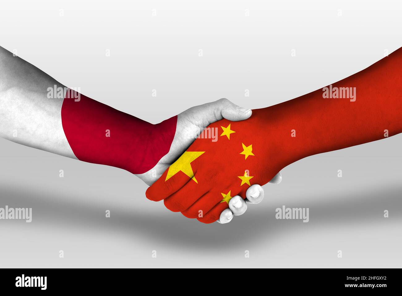 Handshake between canada and japan flags painted on hands, illustration ...