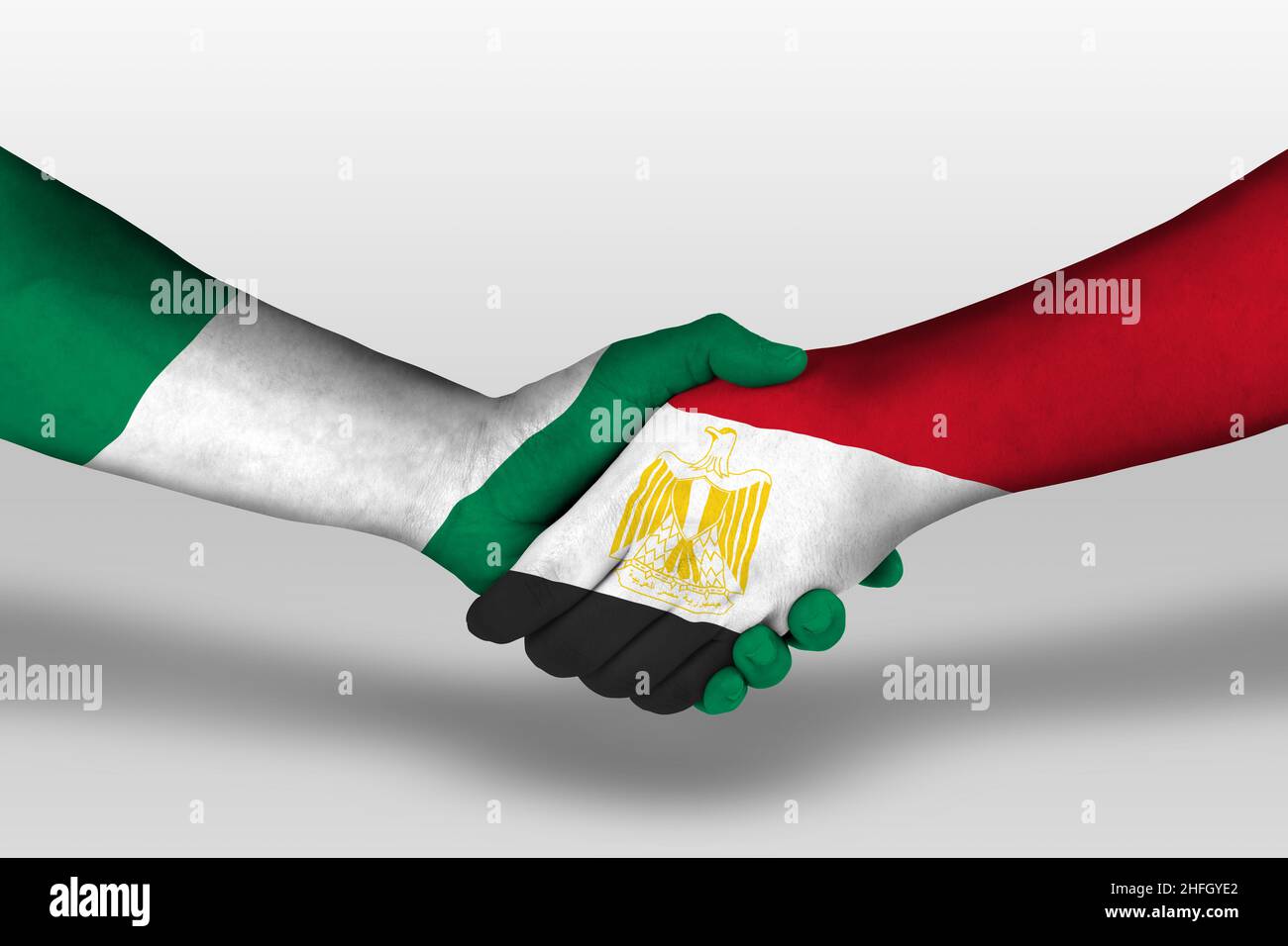 Handshake between egypt and nigeria flags painted on hands ...