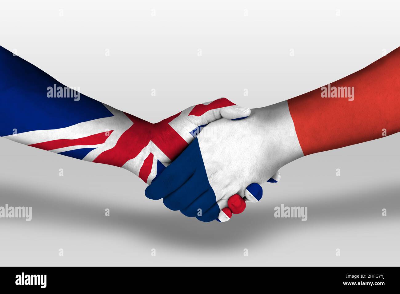 Handshake between european union and united kingdom flags painted on ...