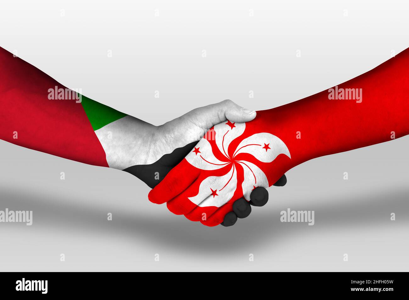 Handshake between germany and united arab emirates flags painted on ...