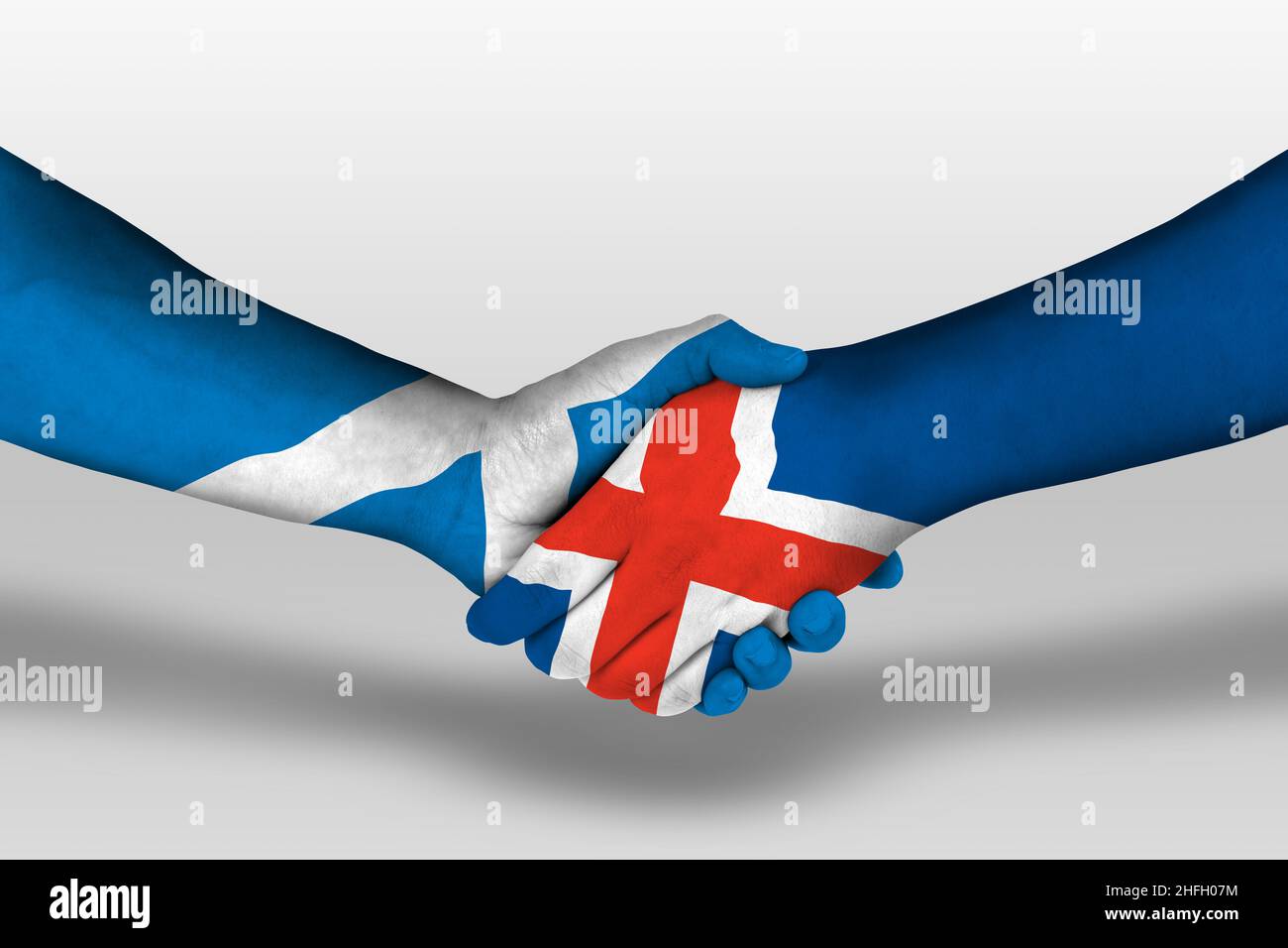 Handshake between greece and scotland flags painted on hands ...