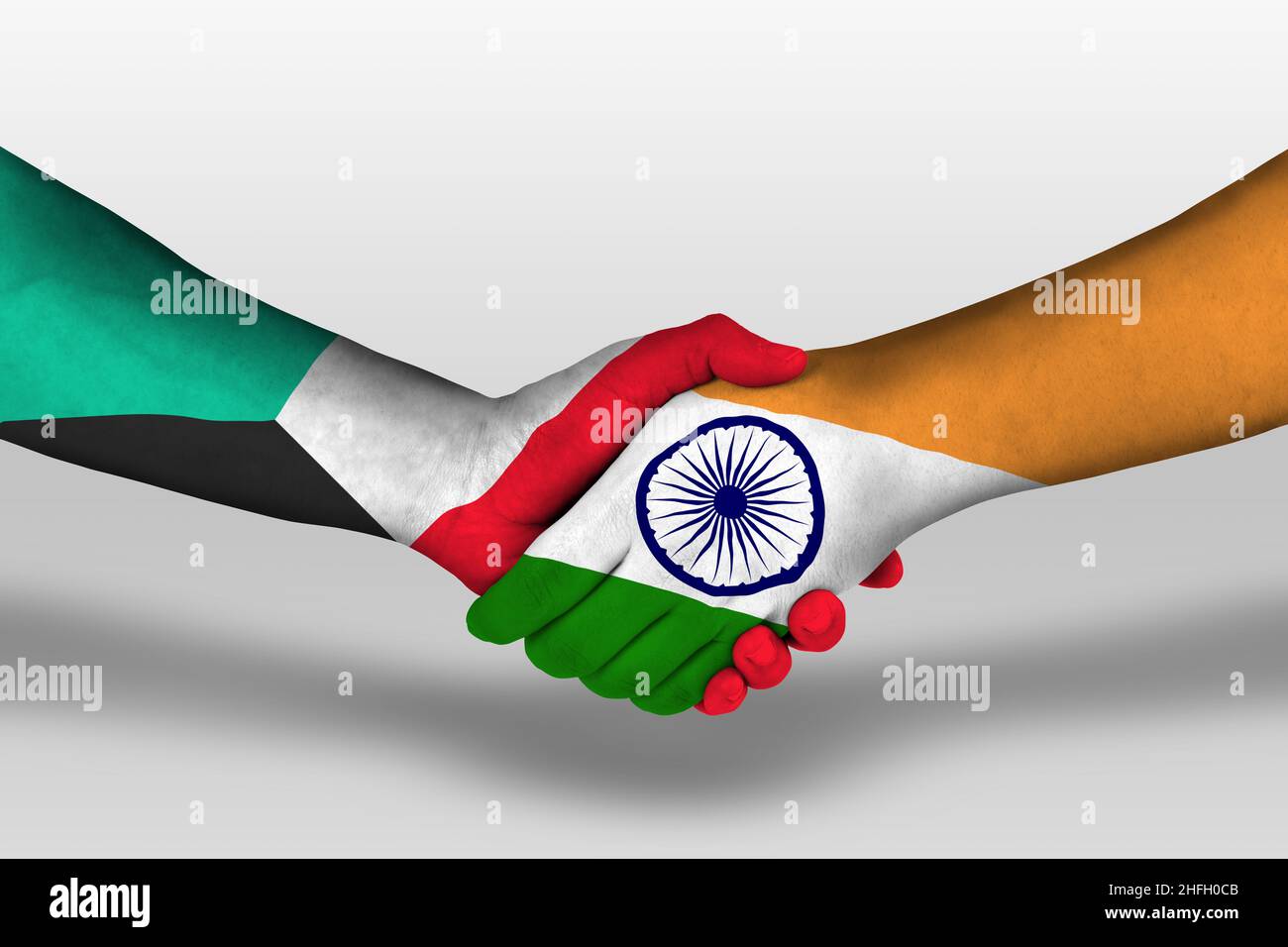 Handshake between hungary and kuwait flags painted on hands ...