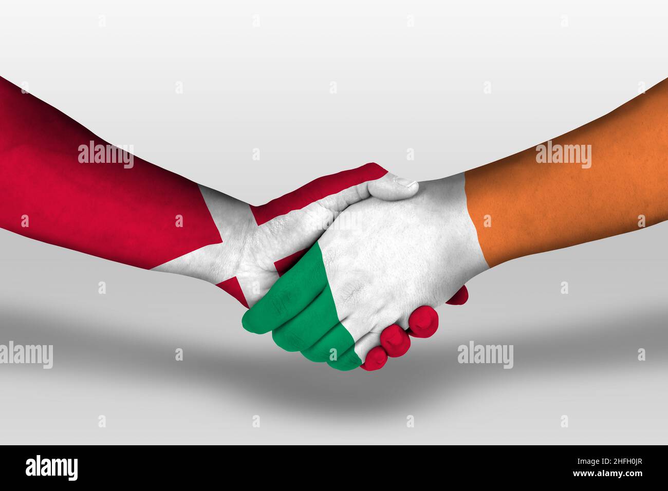 Handshake between iran and denmark flags painted on hands, illustration ...