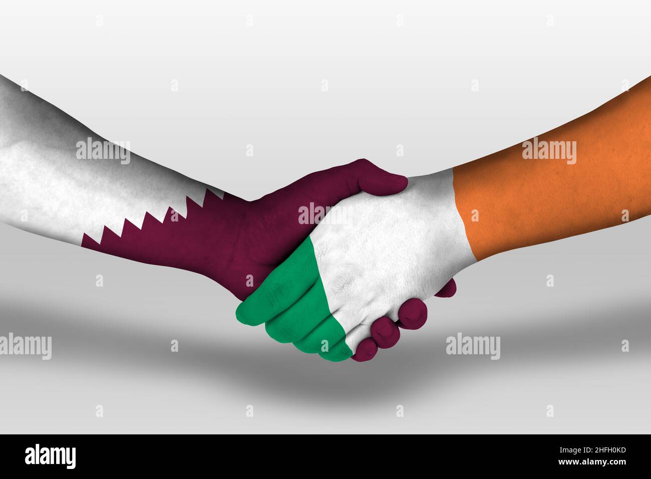 Handshake between iran and qatar flags painted on hands, illustration ...