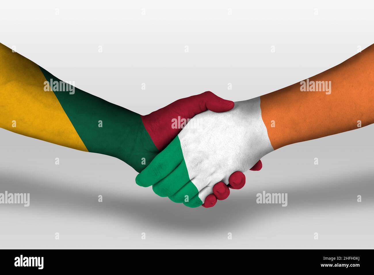 Handshake between iran and lithuania flags painted on hands ...