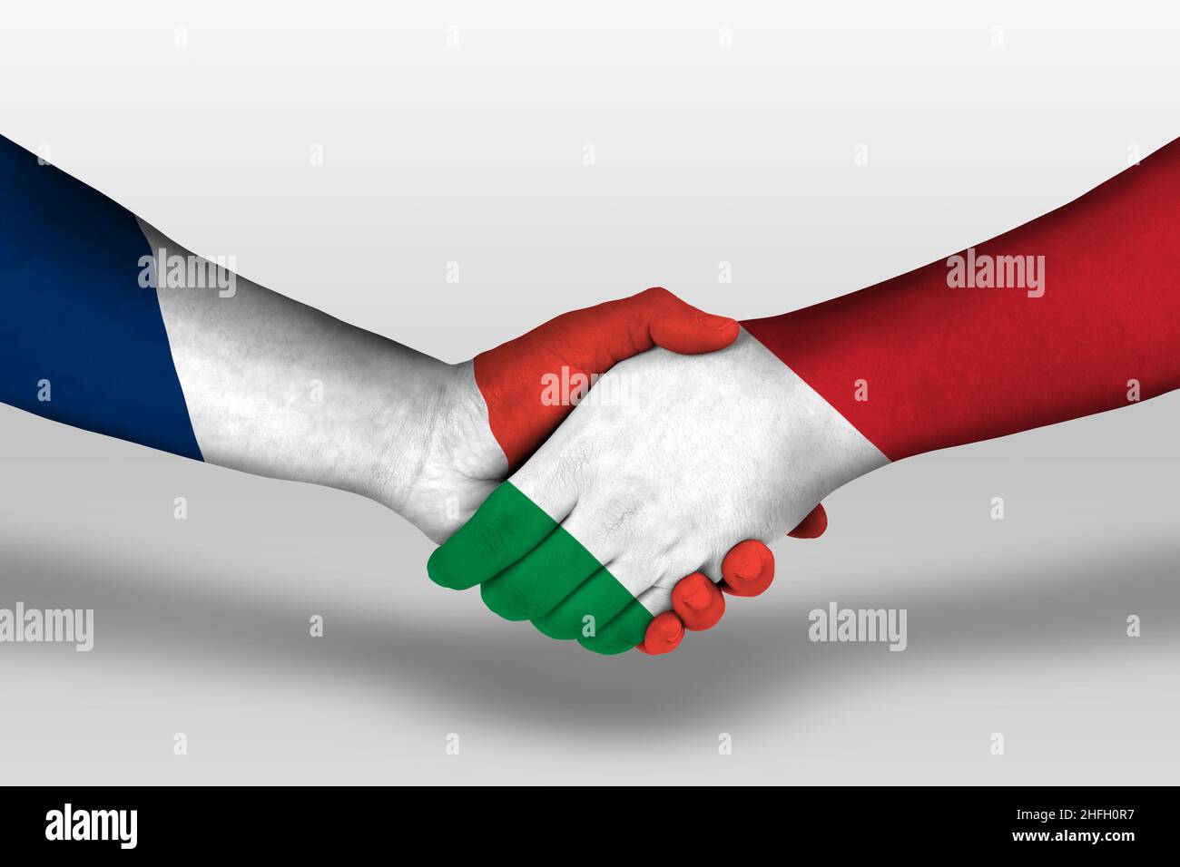 Handshake between ireland and france flags painted on hands ...