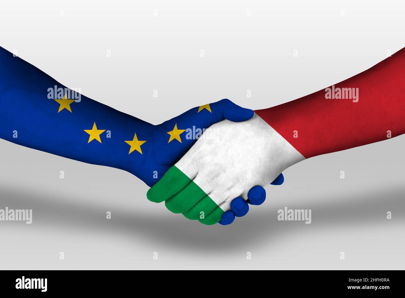 Handshake between ireland and european union flags painted on hands ...