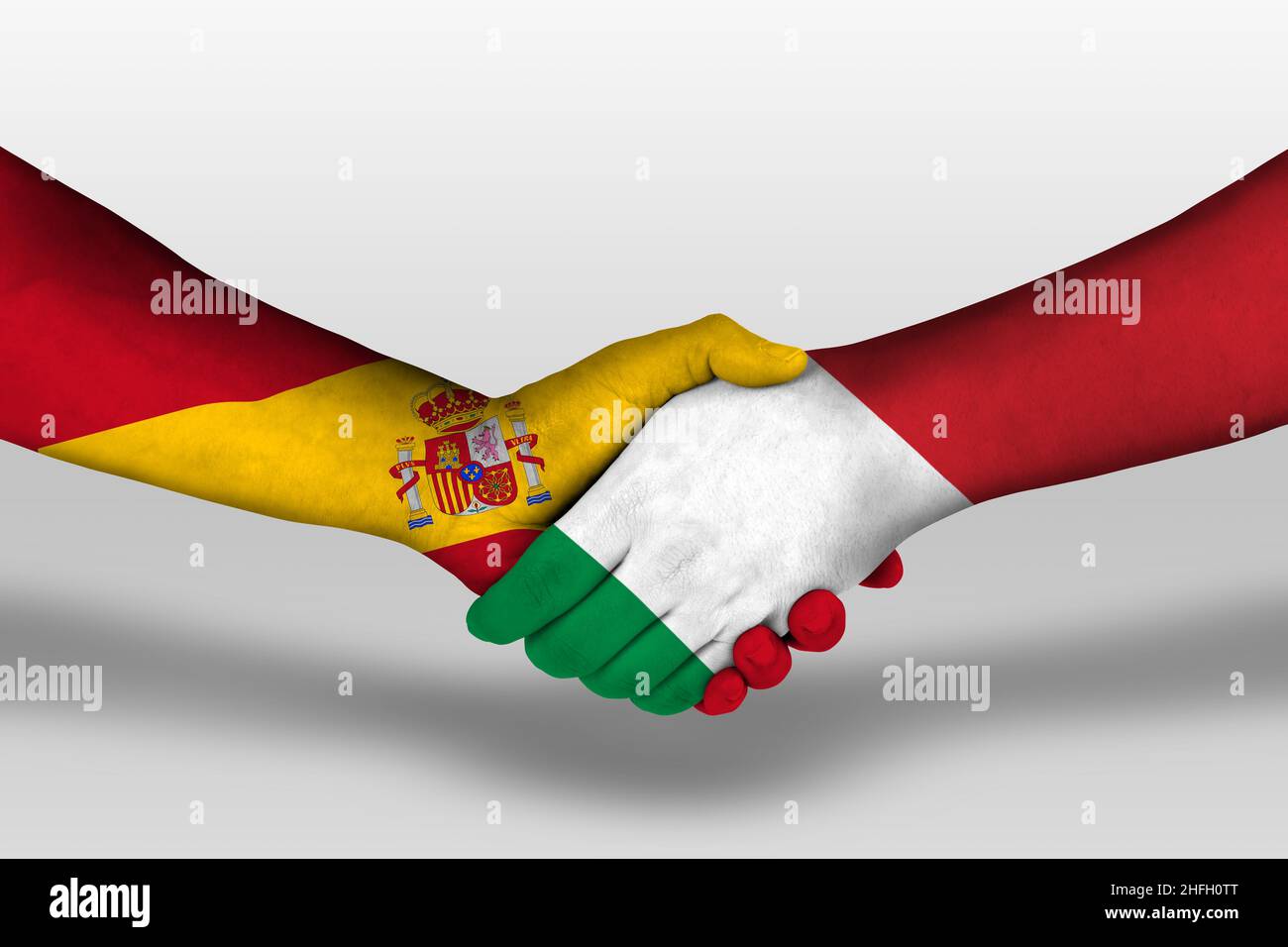 Handshake between ireland and spain flags painted on hands ...