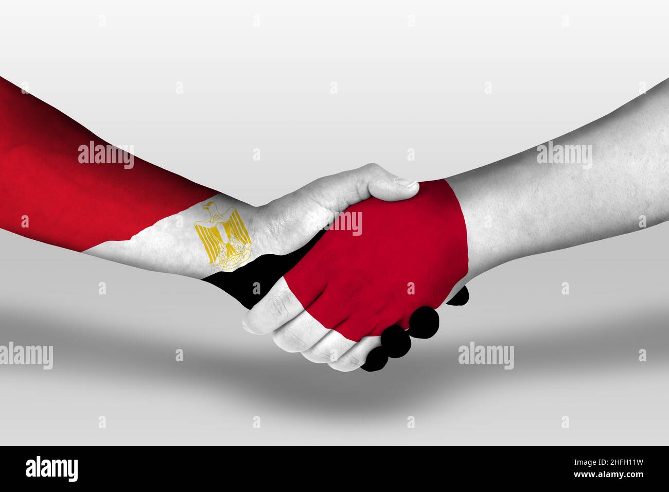 Handshake between japan and egypt flags painted on hands, illustration ...