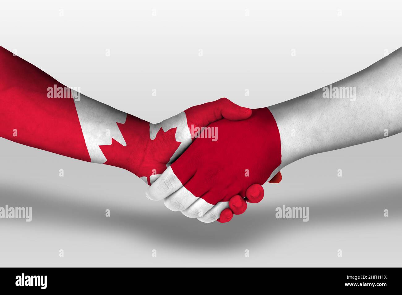 Handshake between japan and canada flags painted on hands, illustration ...