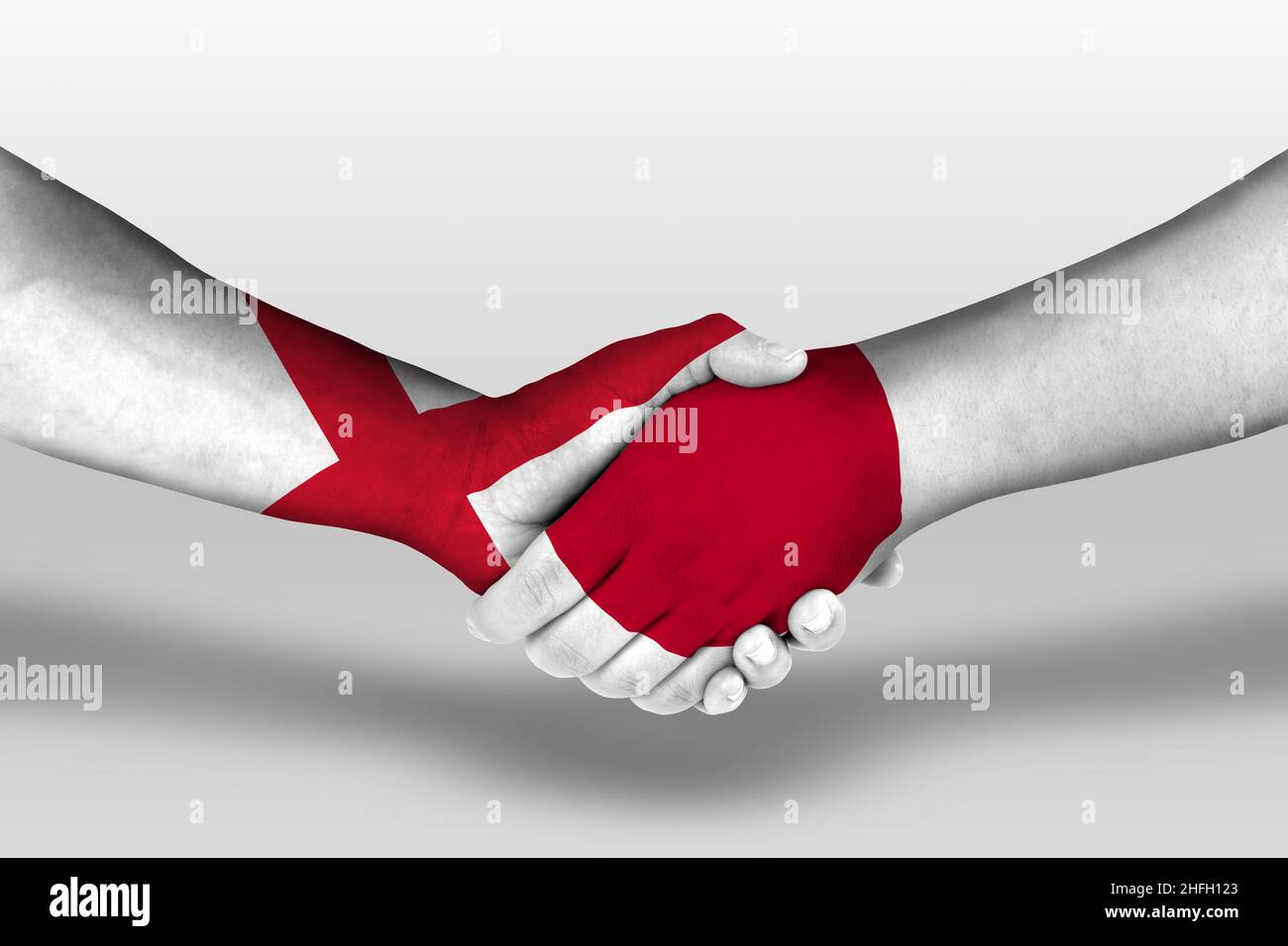 Handshake between japan and england flags painted on hands ...