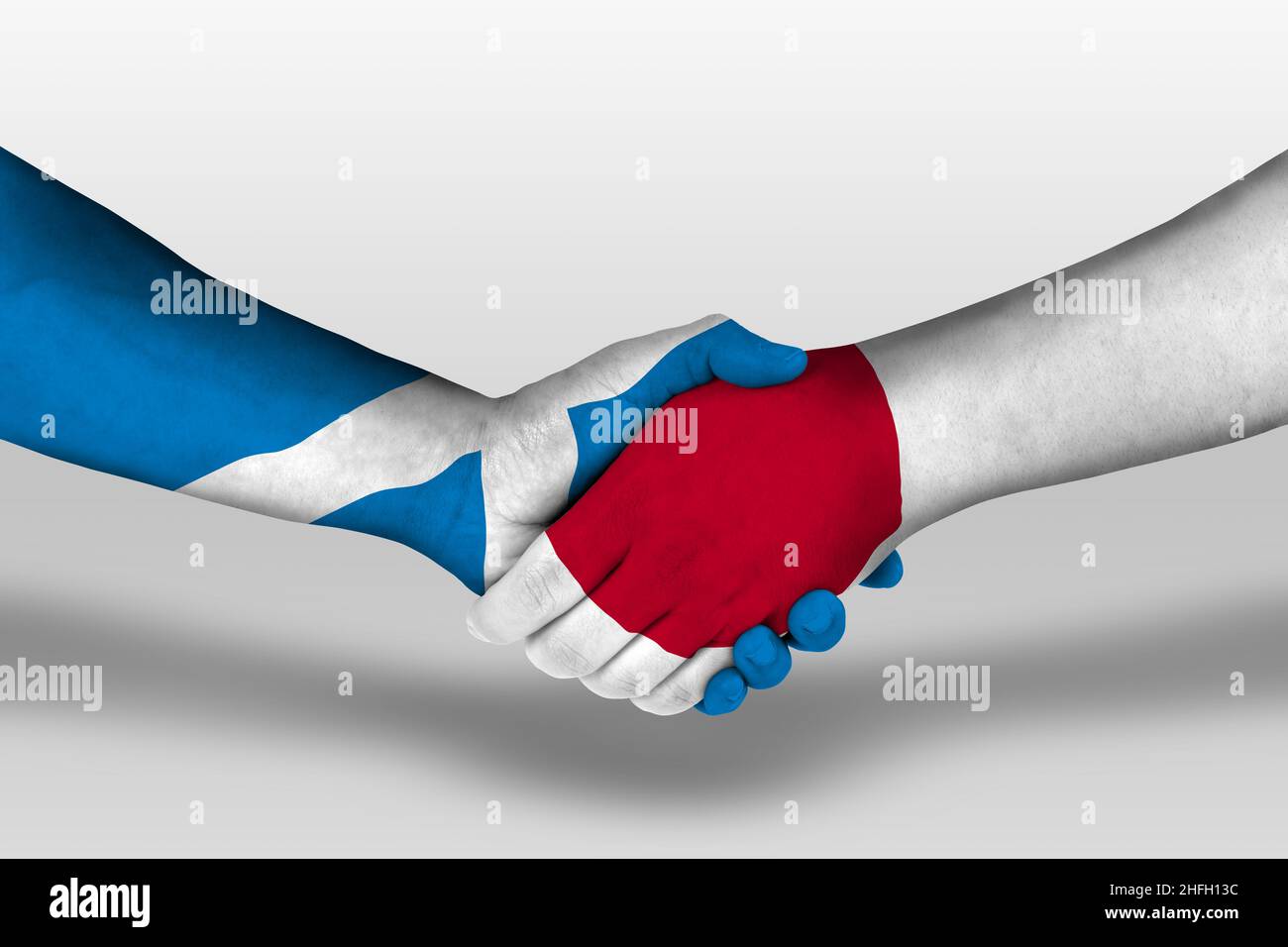 Handshake between japan and scotland flags painted on hands ...