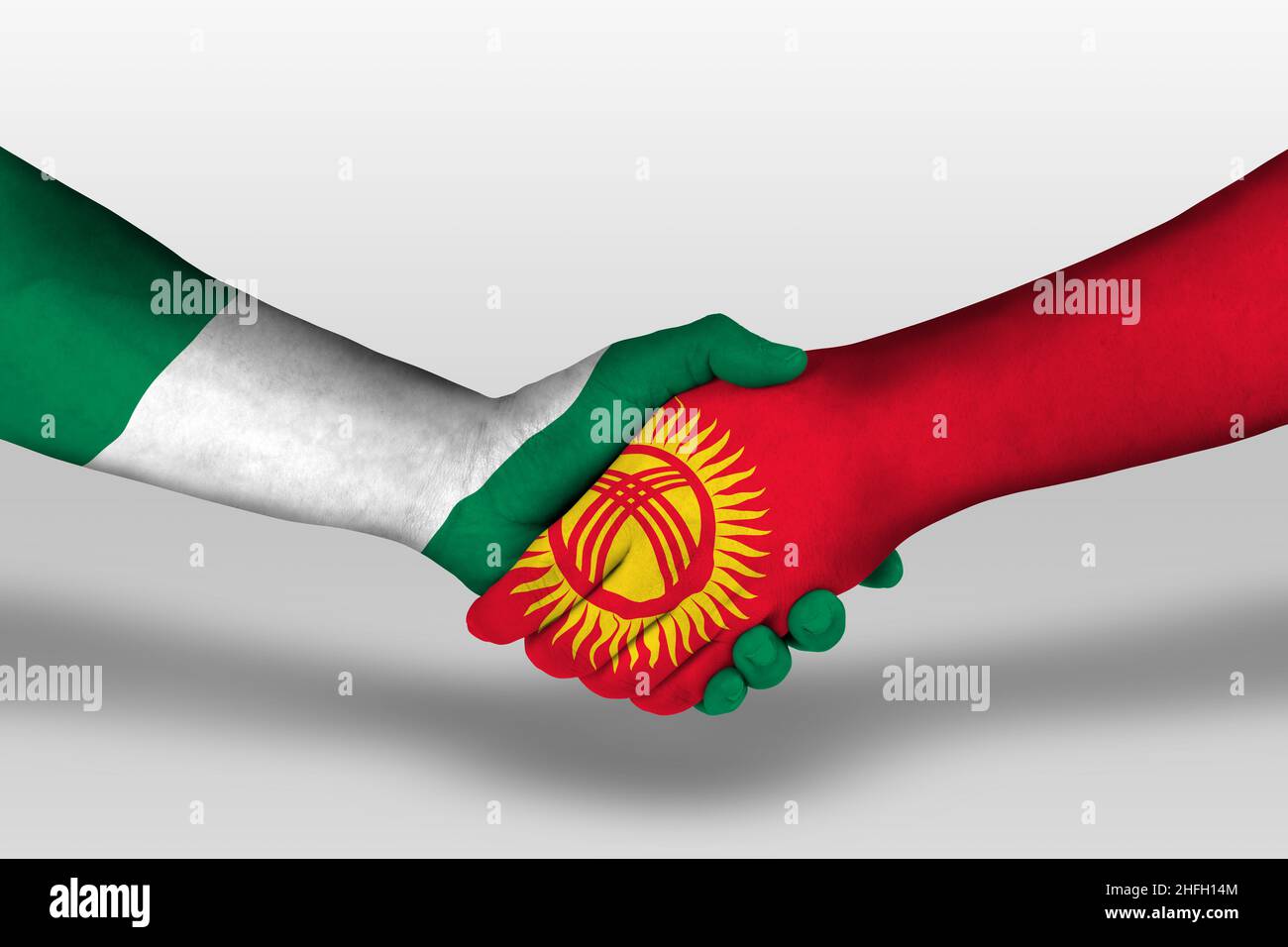 Handshake between kyrgyzstan and nigeria flags painted on hands ...