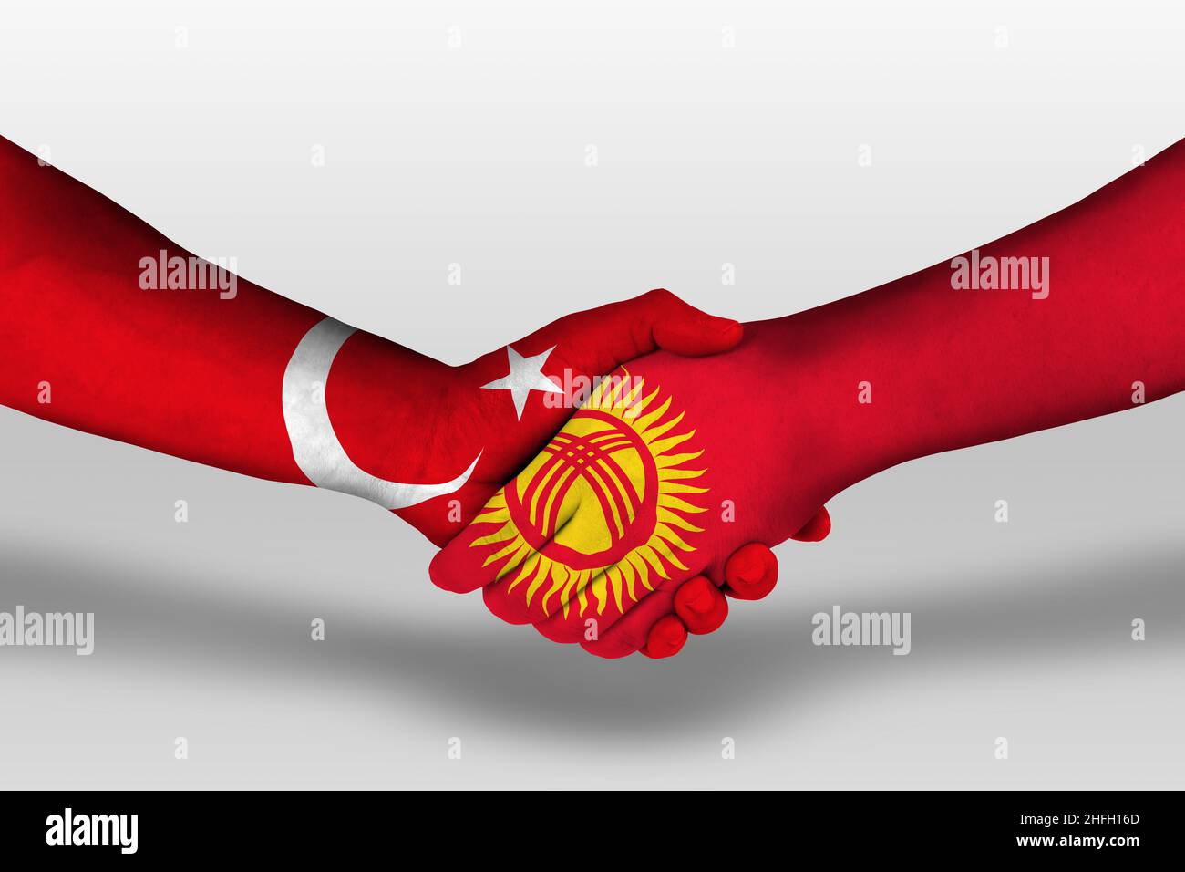 Handshake between kyrgyzstan and turkey flags painted on hands ...