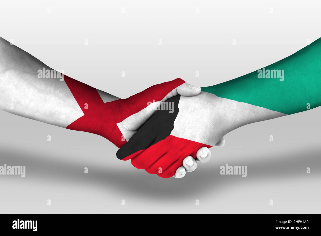 Handshake between kuwait and england flags painted on hands ...