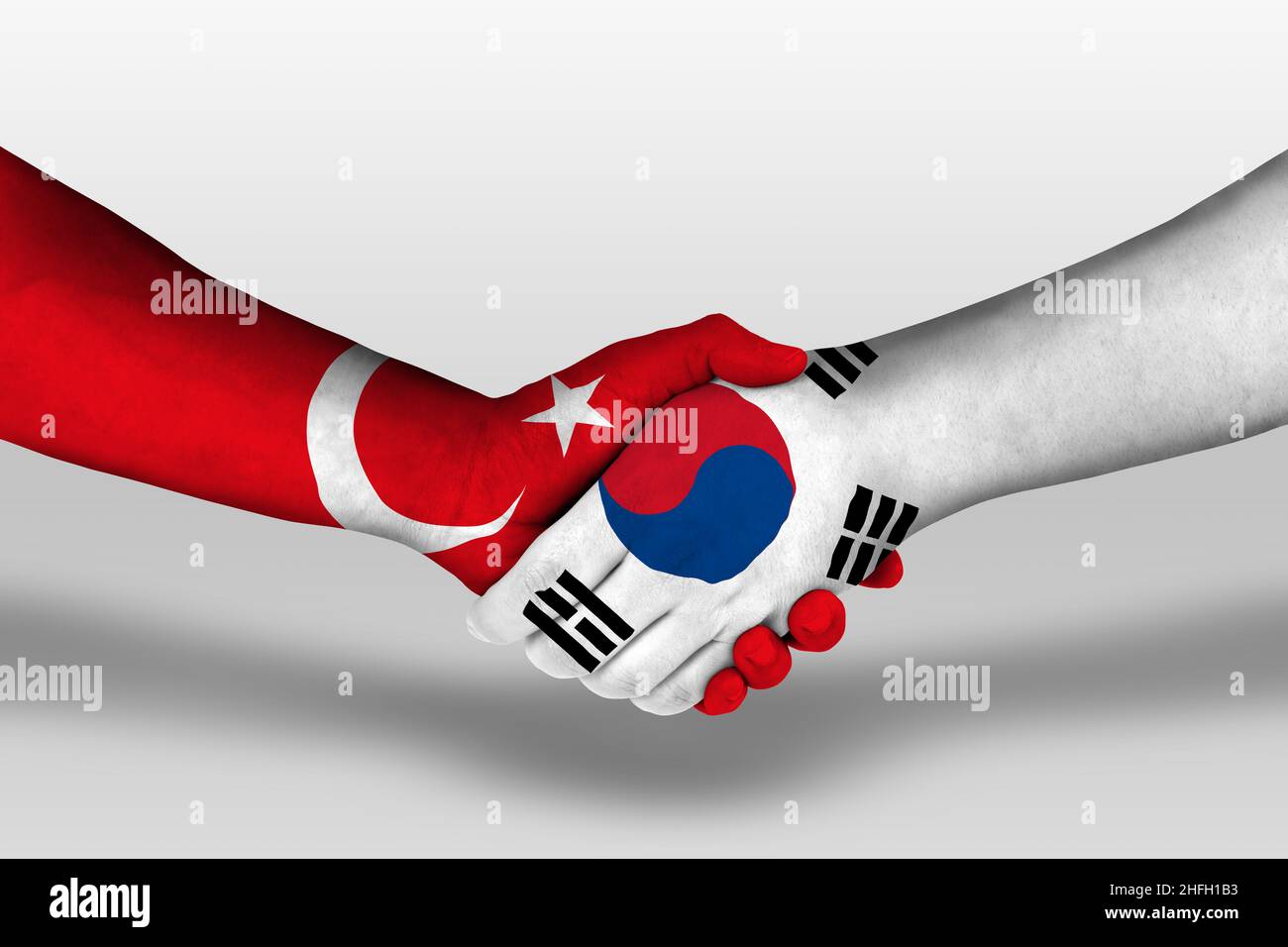 Handshake between south korea and turkey flags painted on hands ...