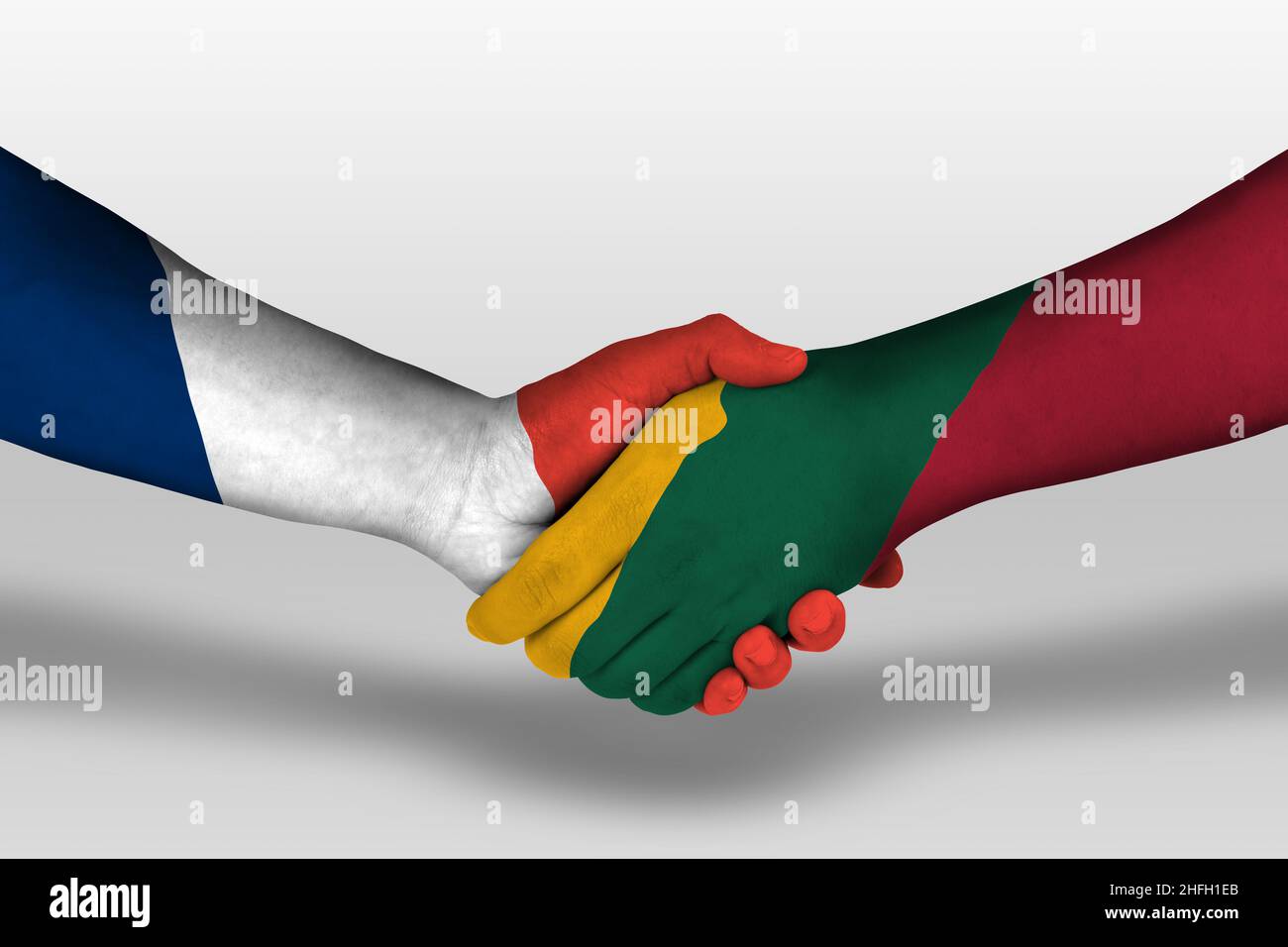 Handshake between lithuania and france flags painted on hands ...