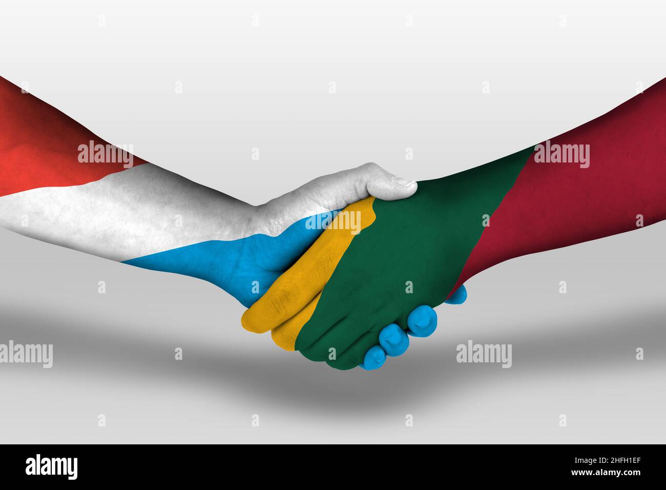 Handshake between lithuania and luxembourg flags painted on hands ...