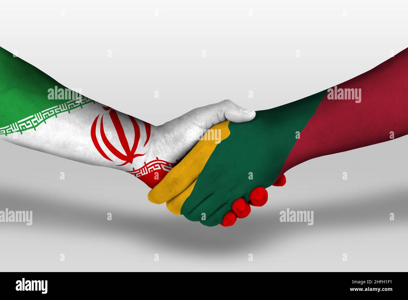 Handshake between lithuania and iran flags painted on hands ...