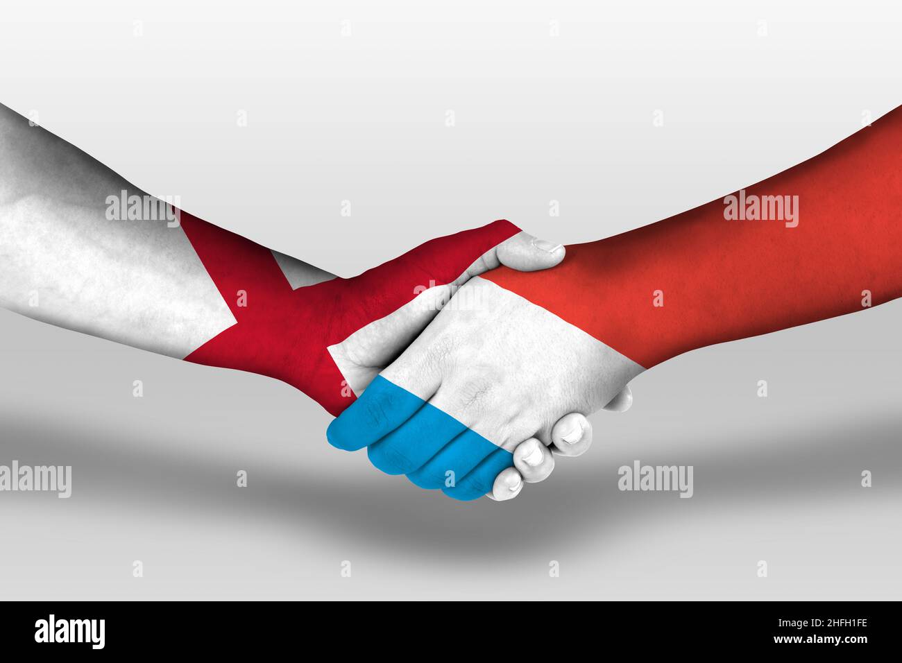 Handshake between luxembourg and england flags painted on hands ...