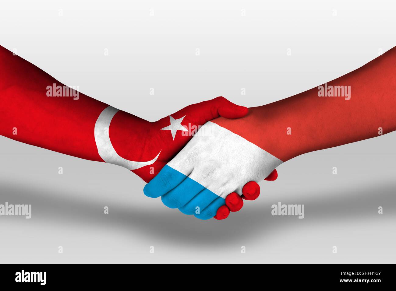 Handshake between luxembourg and turkey flags painted on hands ...