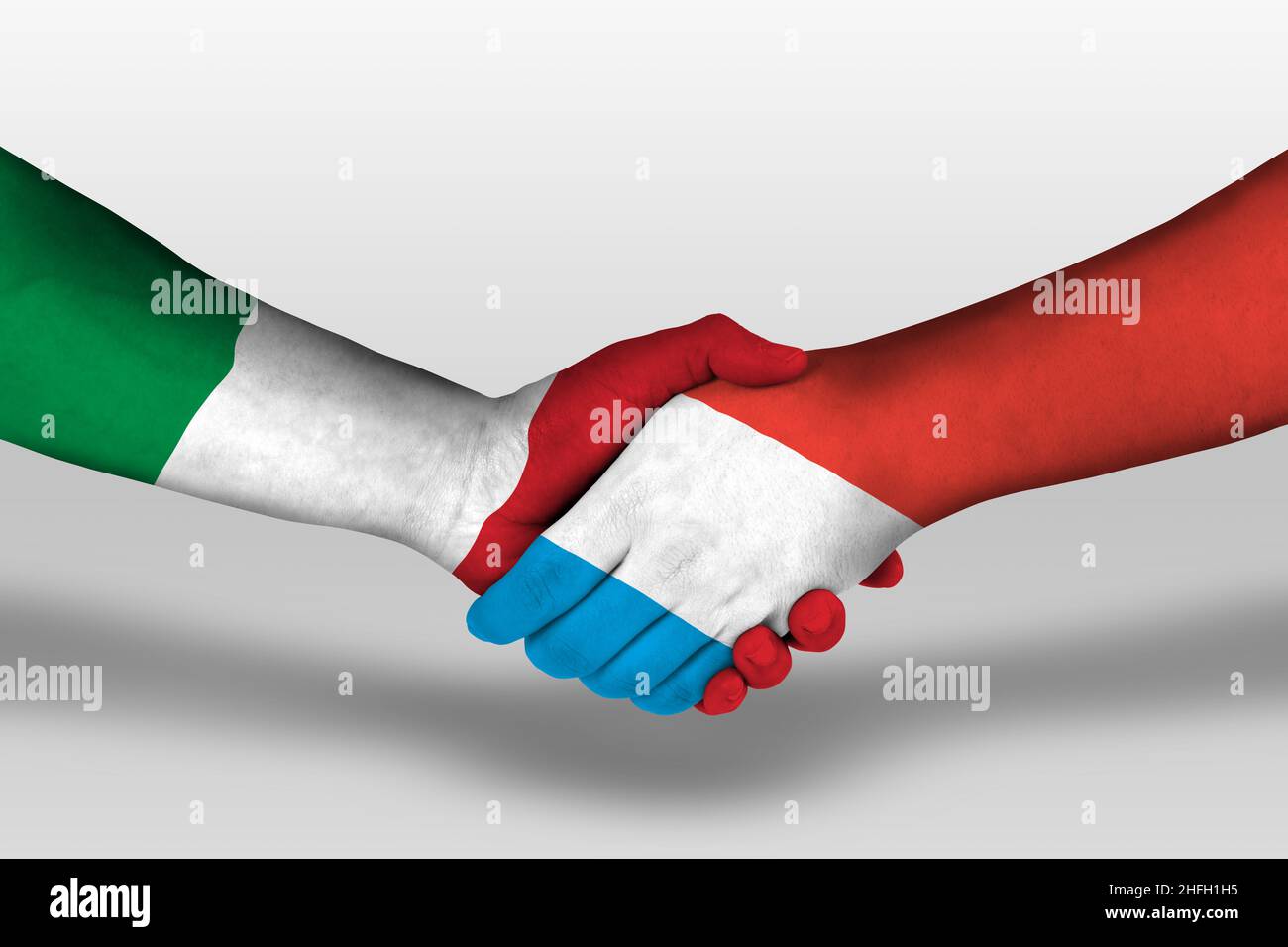 Handshake between luxembourg and italy flags painted on hands ...