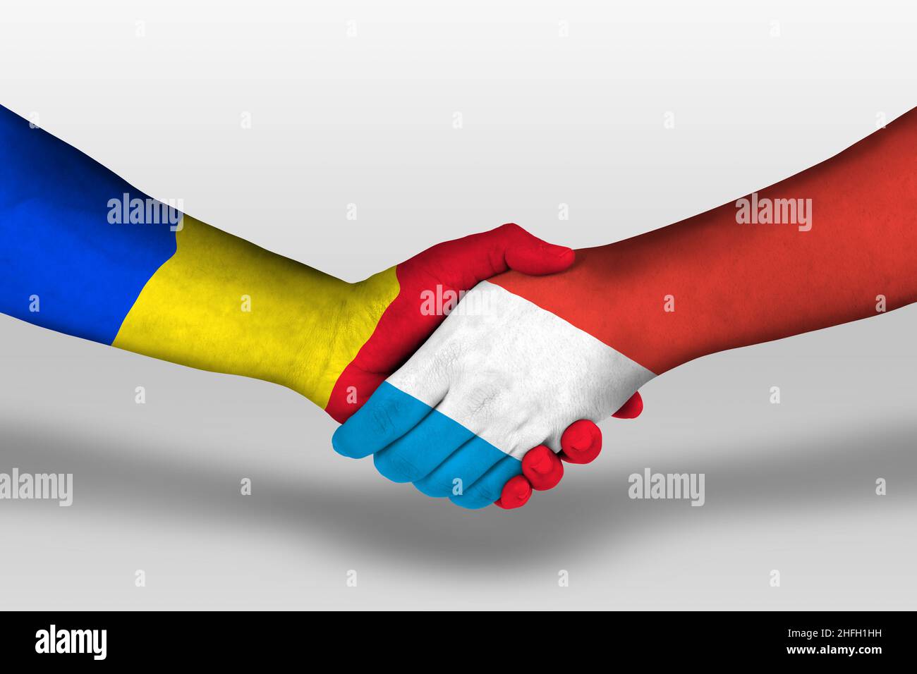 Handshake between luxembourg and romania flags painted on hands ...