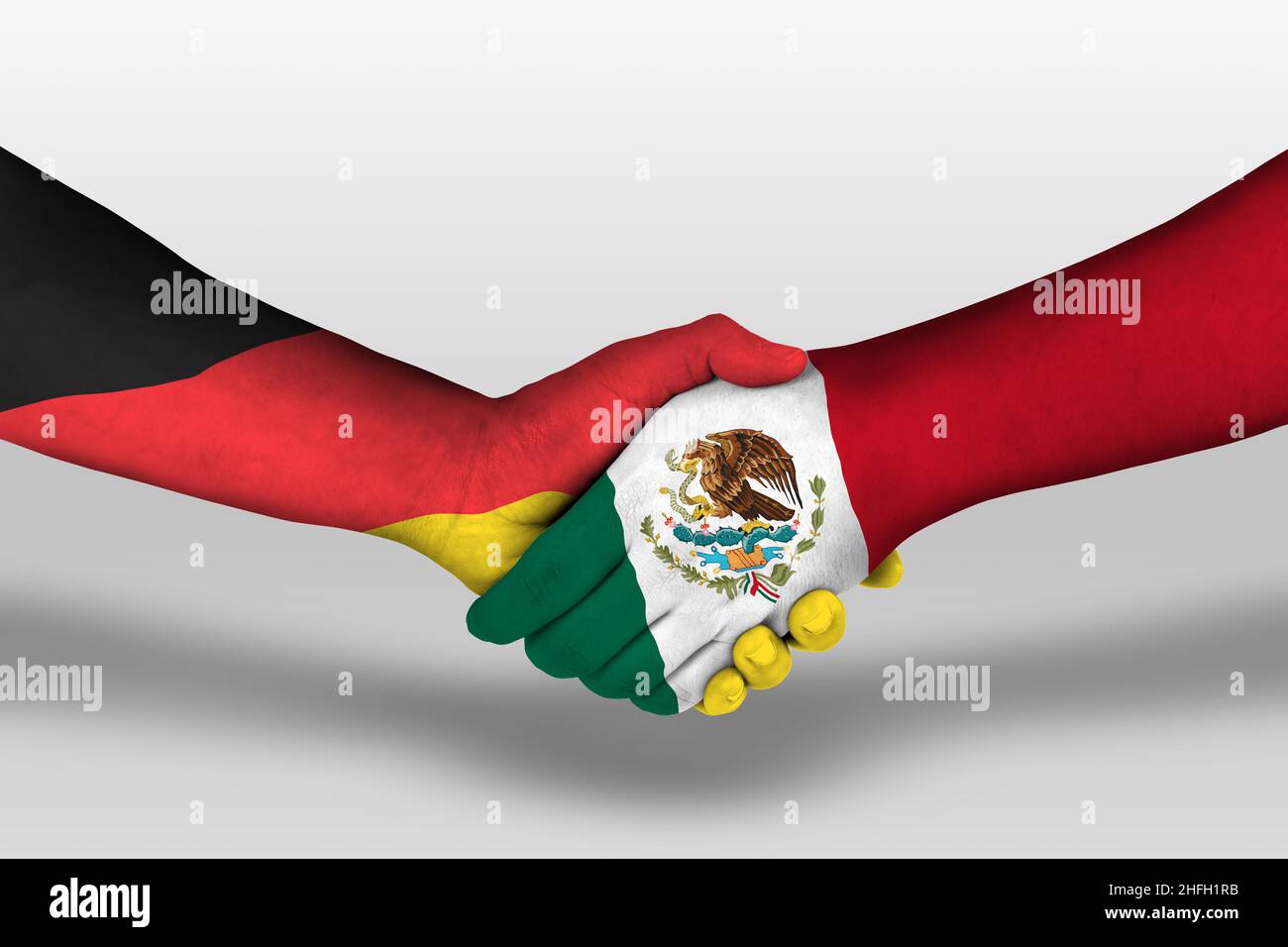 Handshake between mexico and germany flags painted on hands ...