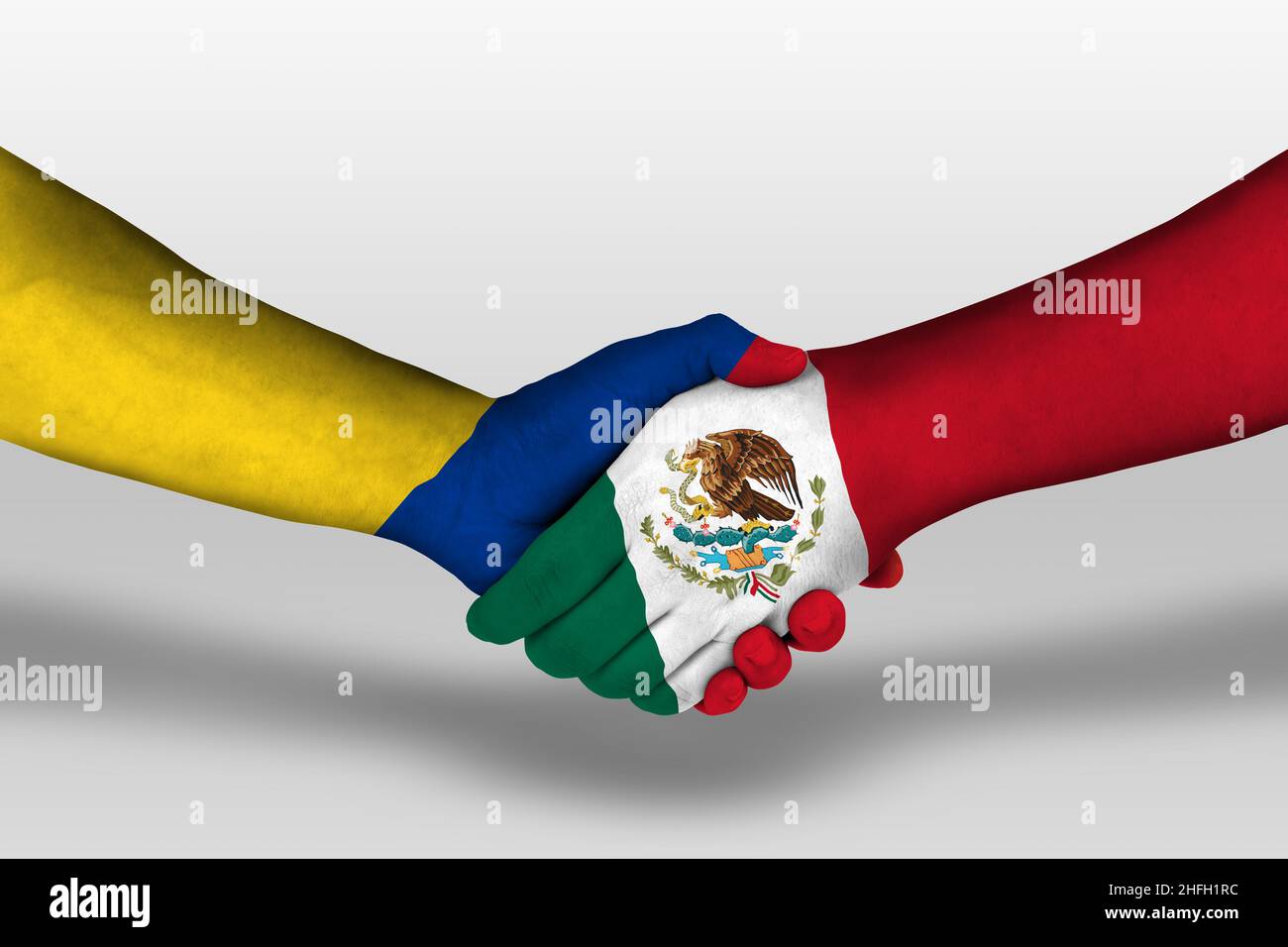 Handshake between mexico and columbia flags painted on hands ...