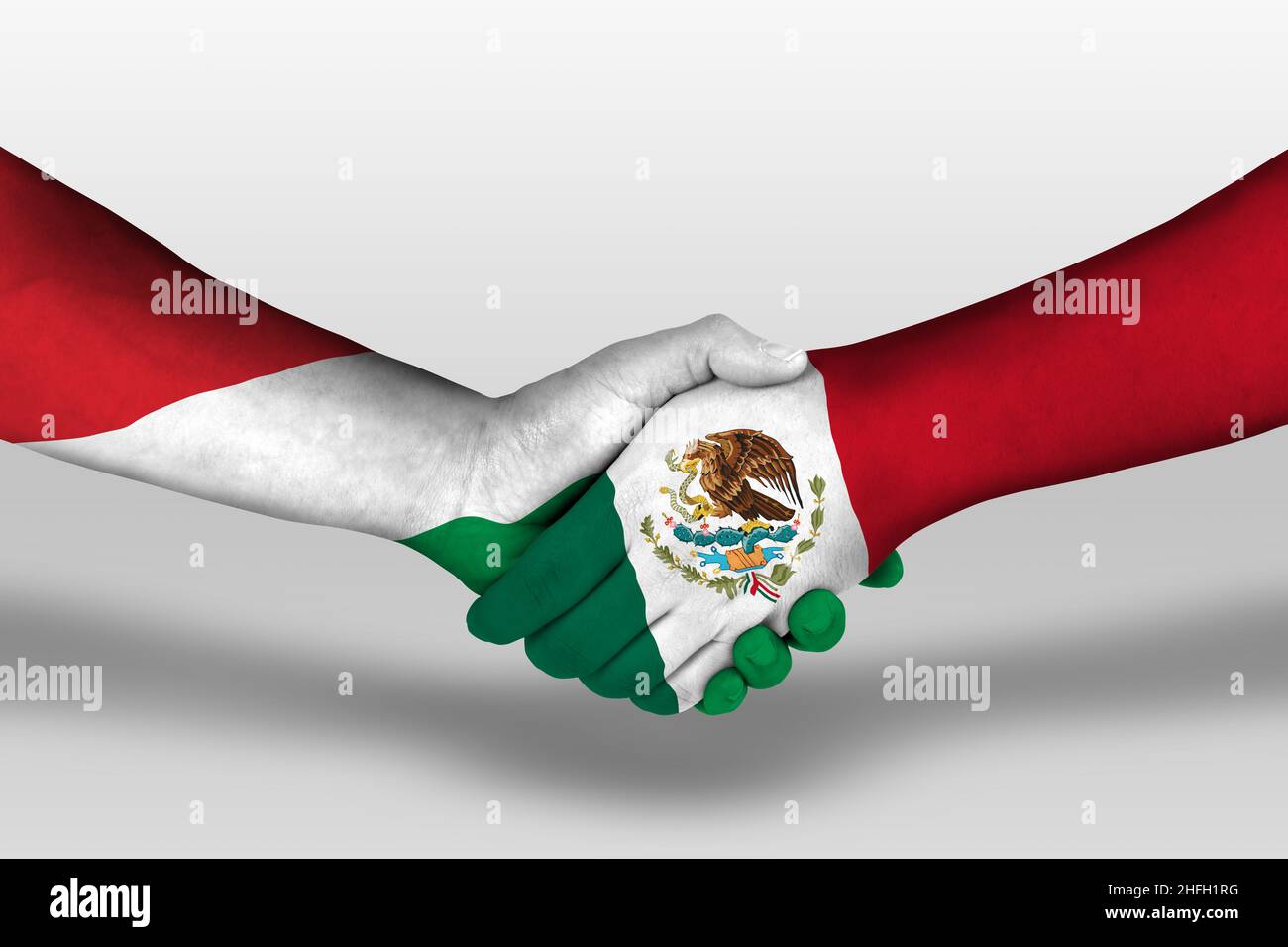 Handshake between mexico and hungary flags painted on hands ...
