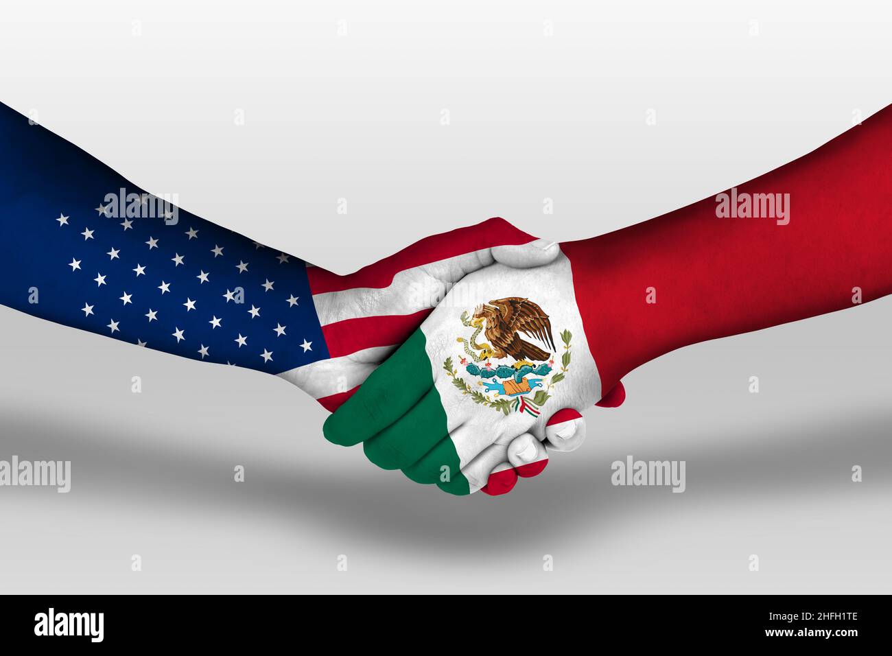 Handshake between mexico and united states of america flags painted on ...