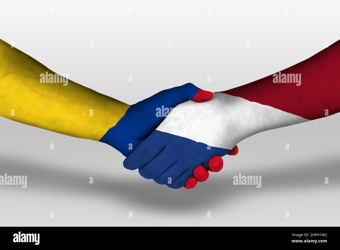 Handshake between netherlands and columbia flags painted on hands ...