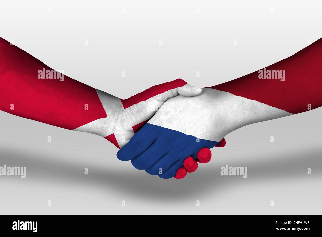 Handshake between netherlands and denmark flags painted on hands ...