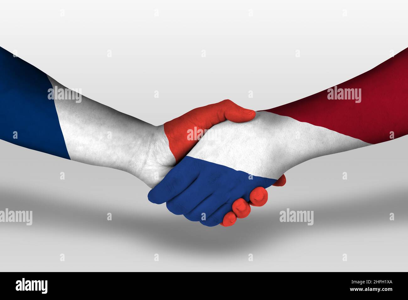 Handshake between netherlands and france flags painted on hands ...