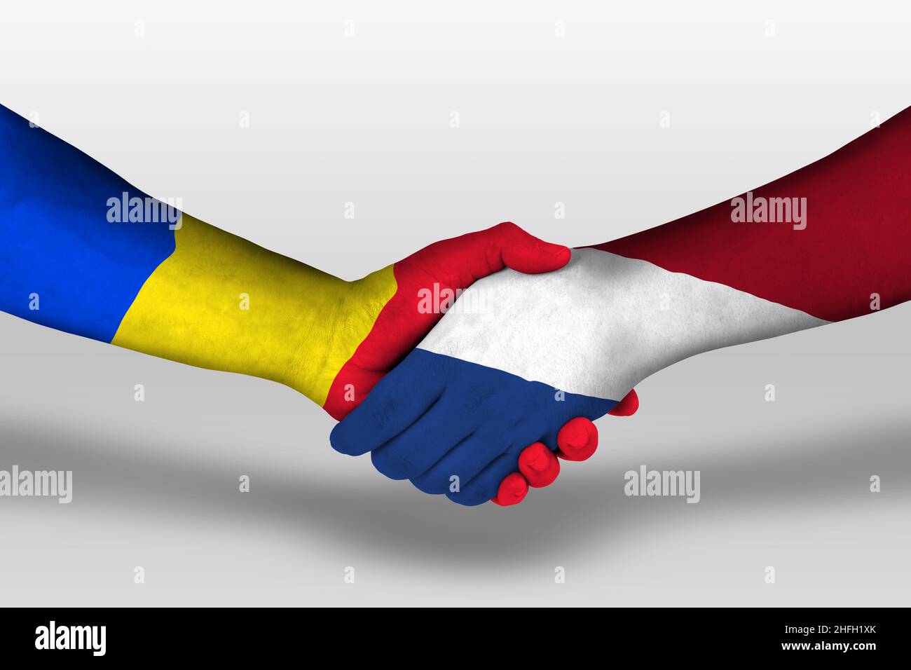 Handshake between netherlands and romania flags painted on hands ...