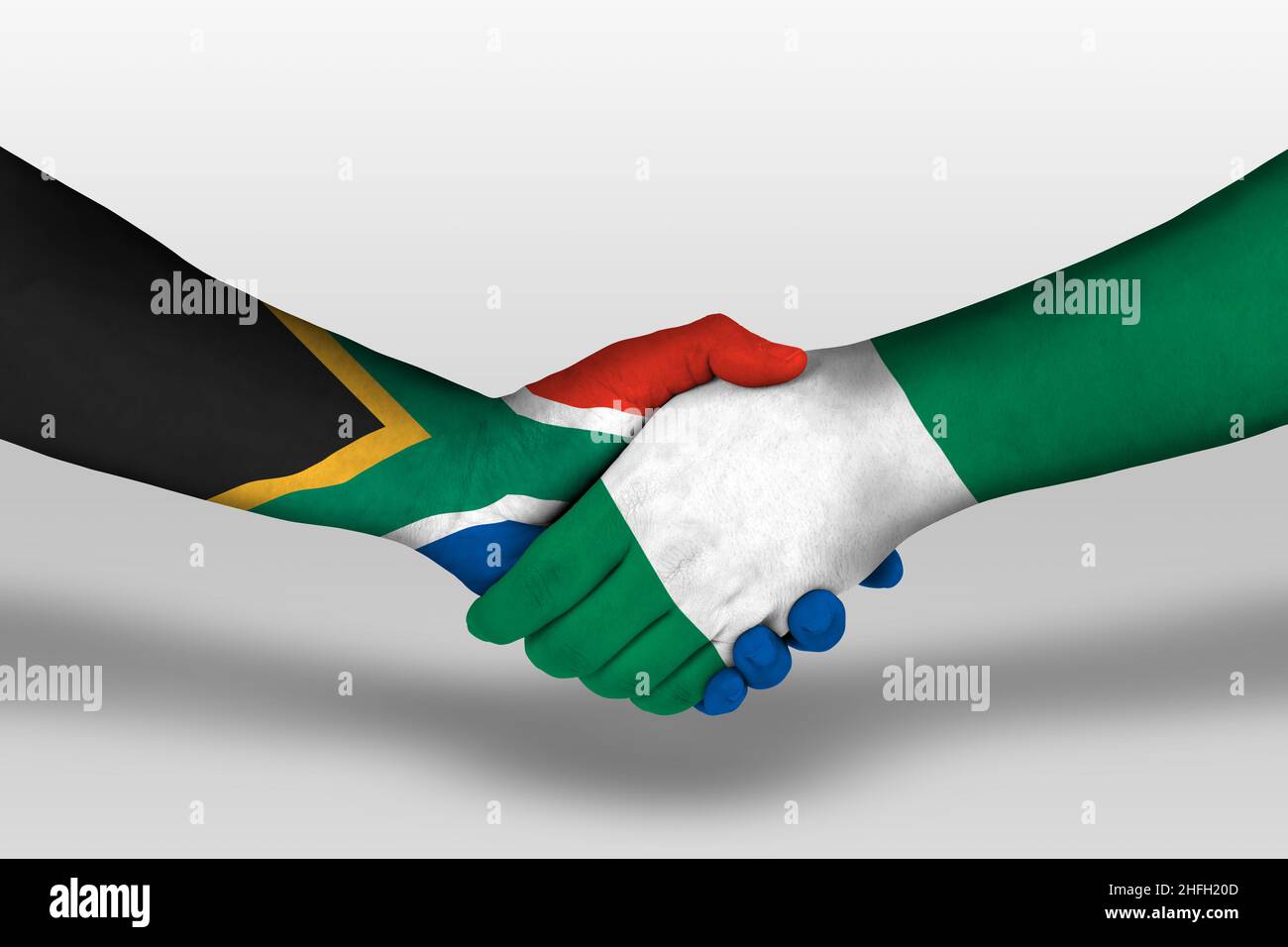 Handshake between nigeria and south africa flags painted on hands ...
