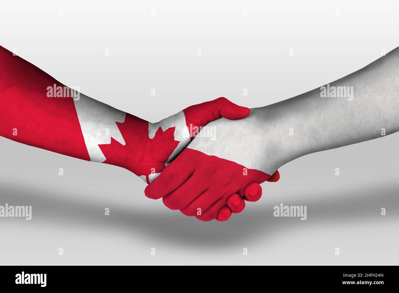 Handshake between poland and canada flags painted on hands ...