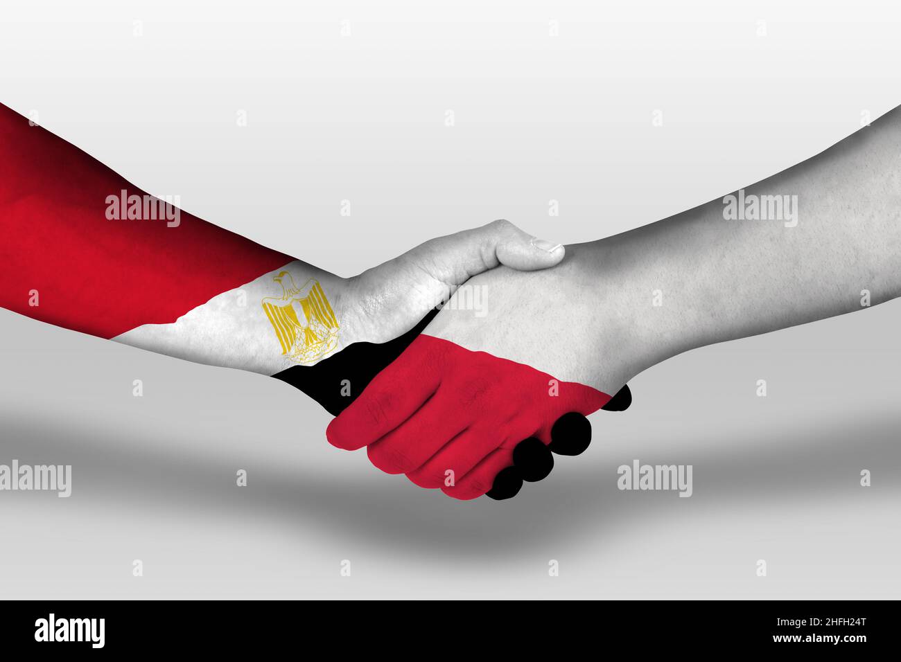 Handshake between poland and egypt flags painted on hands, illustration ...