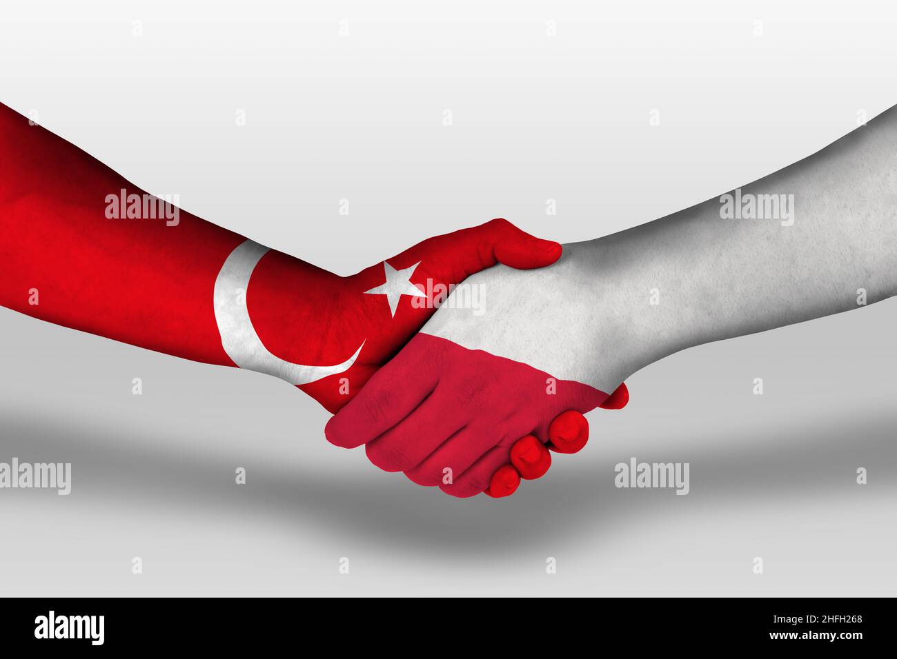 Handshake between poland and turkey flags painted on hands ...