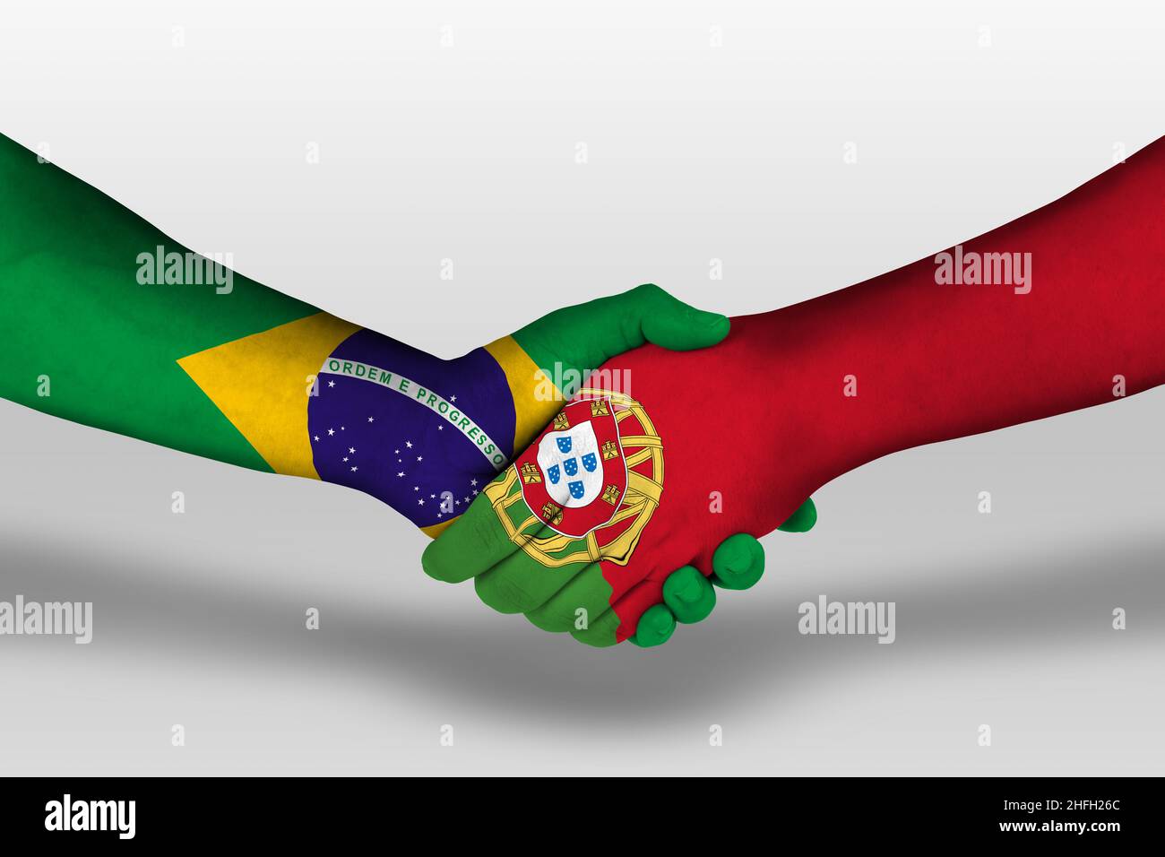 Handshake between portugal and brazil flags painted on hands ...