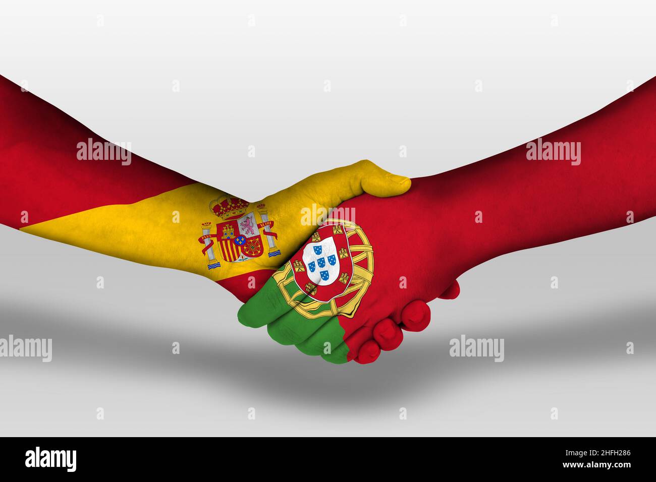 Handshake between portugal and spain flags painted on hands ...