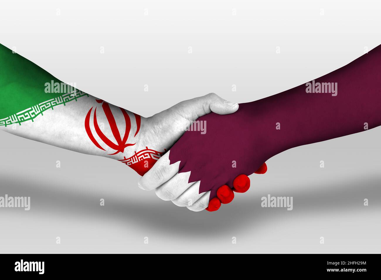 Handshake between qatar and iran flags painted on hands, illustration ...