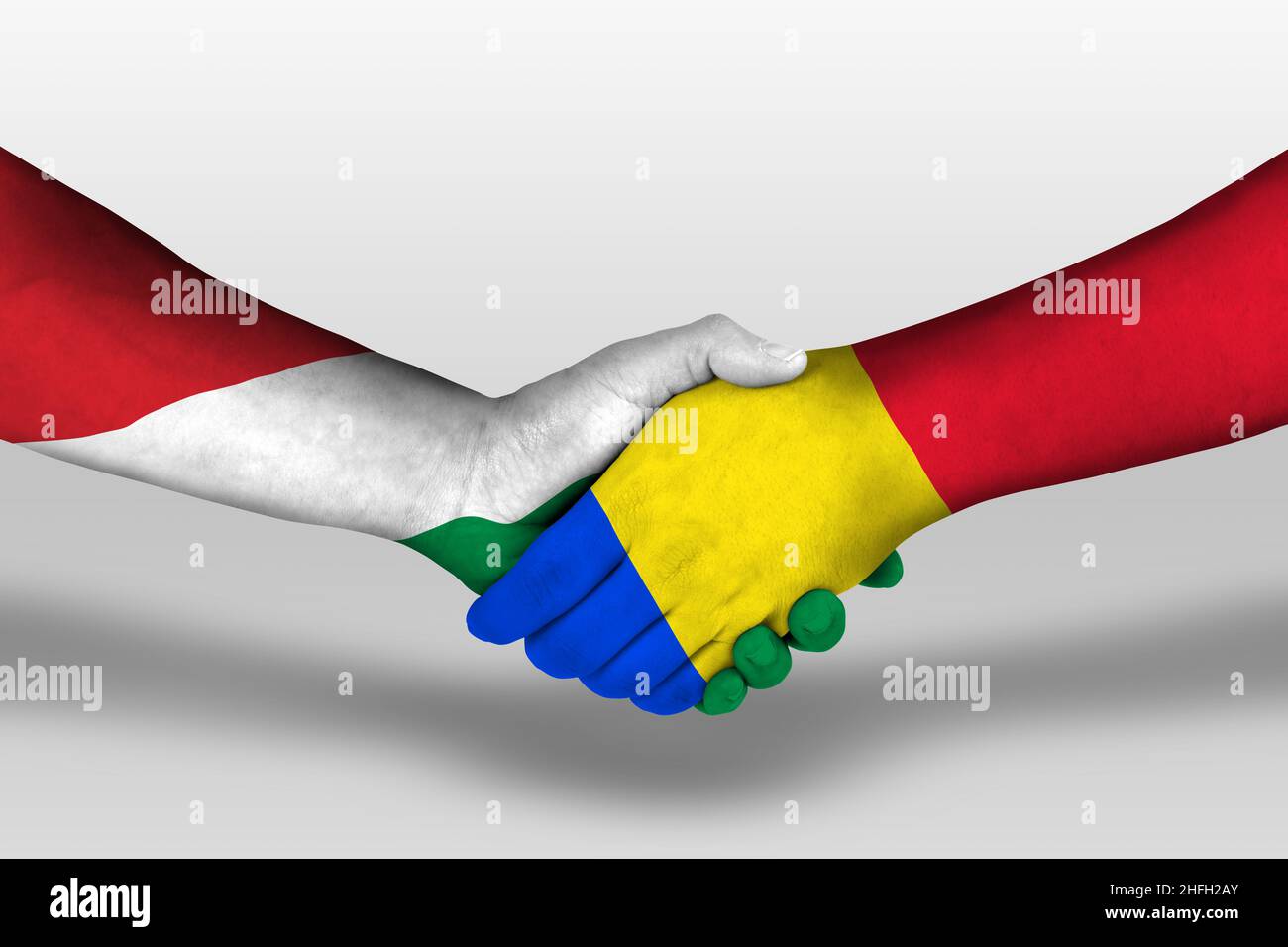 Handshake between romania and hungary flags painted on hands ...
