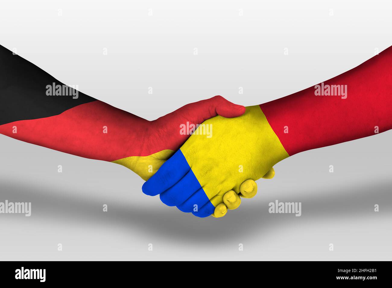 Handshake between romania and germany flags painted on hands ...