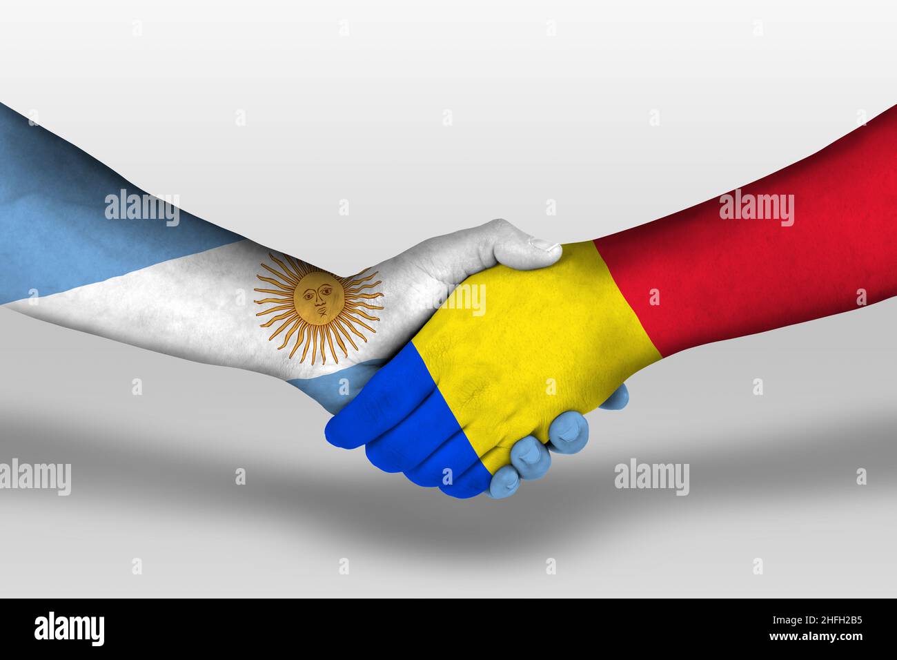 Handshake between romania and argentina flags painted on hands ...